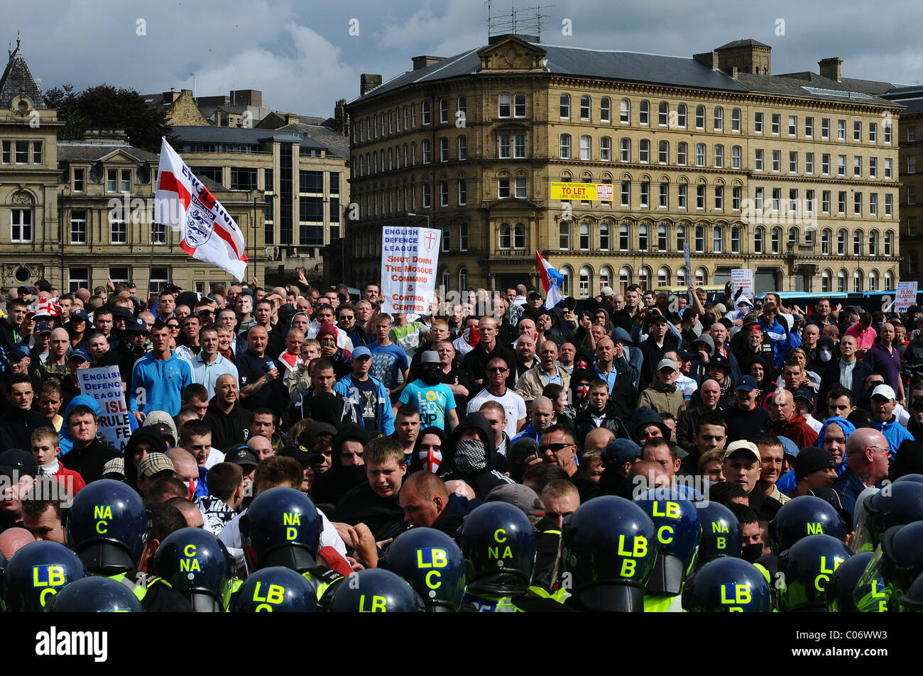 EDL supporters held back by the riot police line Stock Photo - Alamy