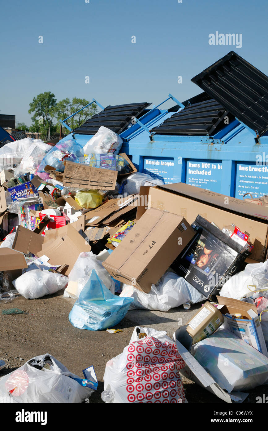 Recycle center drop off container overflows with bags and boxes of ...