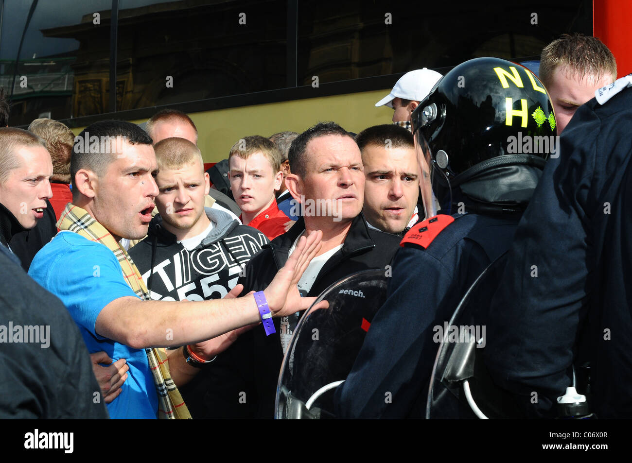 EDL supporter argues with riot police in bradford Stock Photo - Alamy