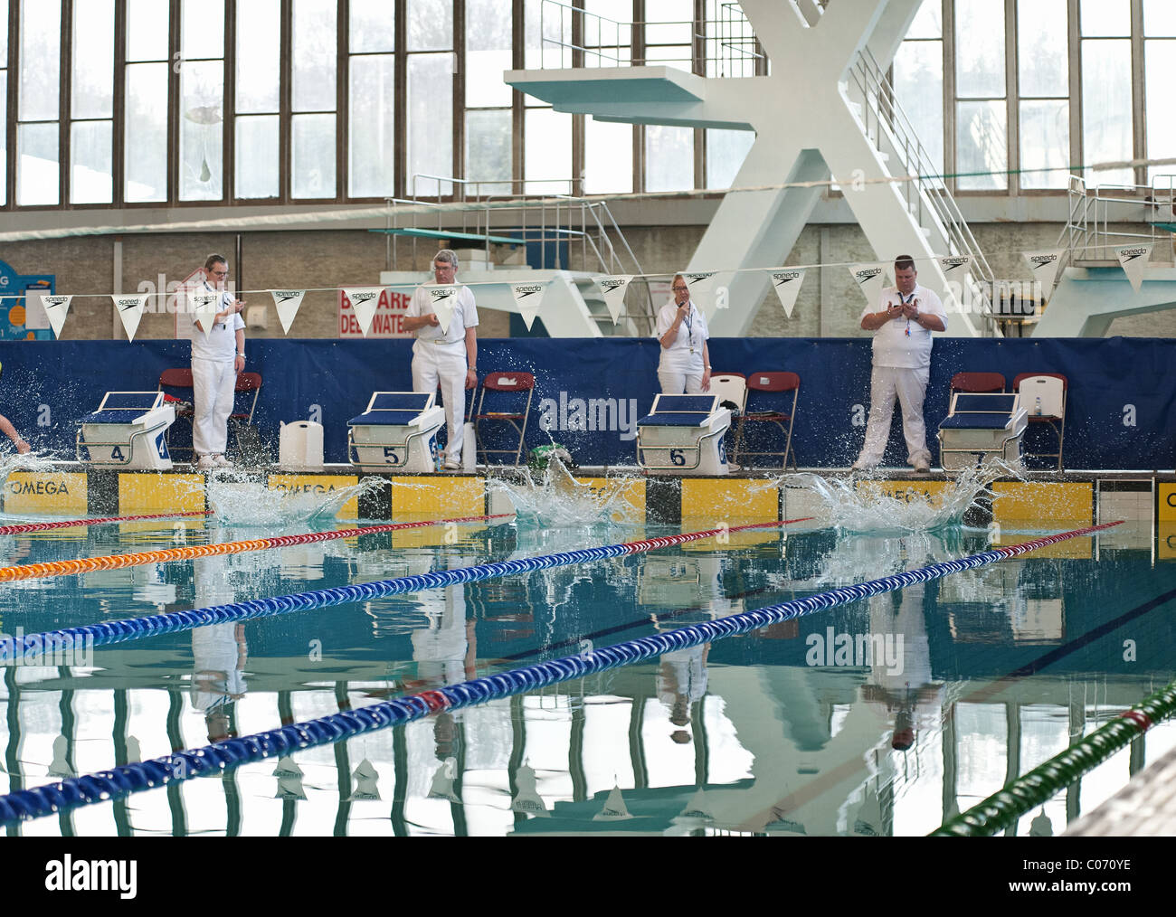 Start of long pool swimming race Stock Photo - Alamy