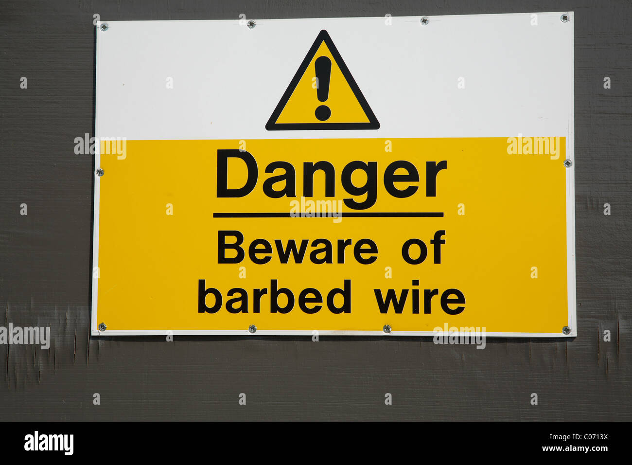 Danger barbed wire Stock Photo - Alamy