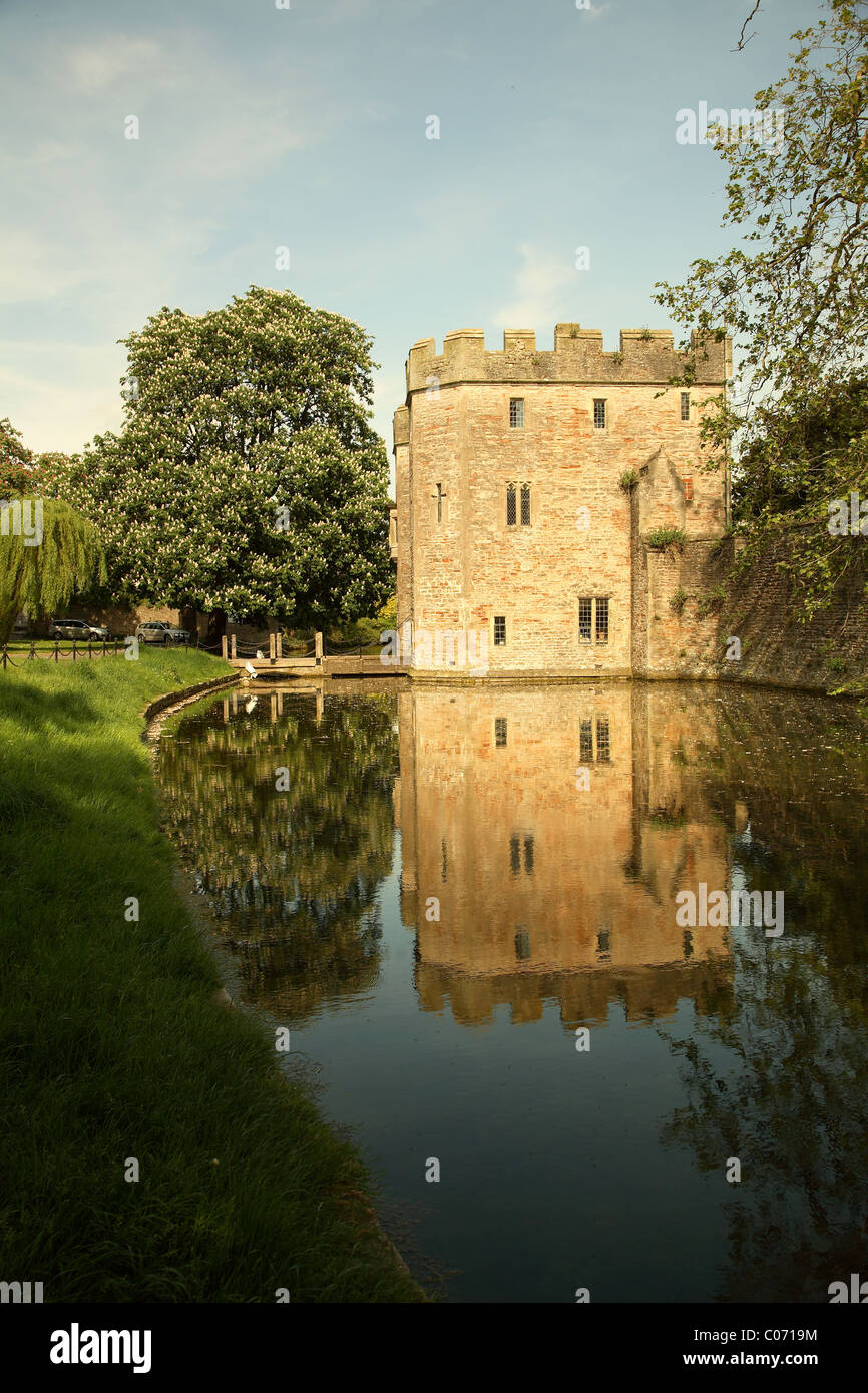 The Bishops palace gate house and moat with reflection Stock Photo - Alamy