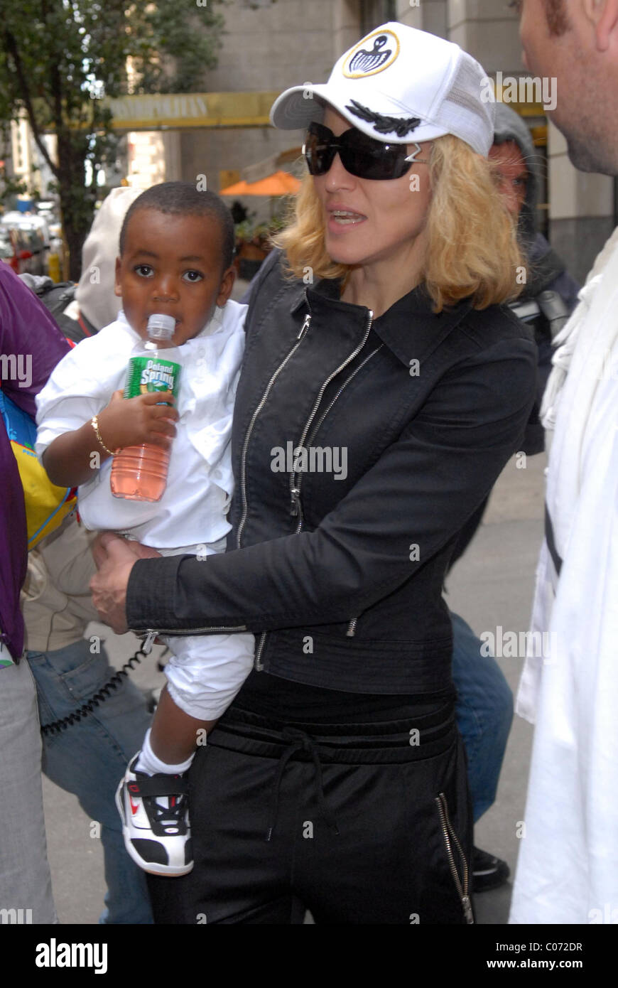Madonna and her adopted son David Banda attending a Kabbalah meeting ...