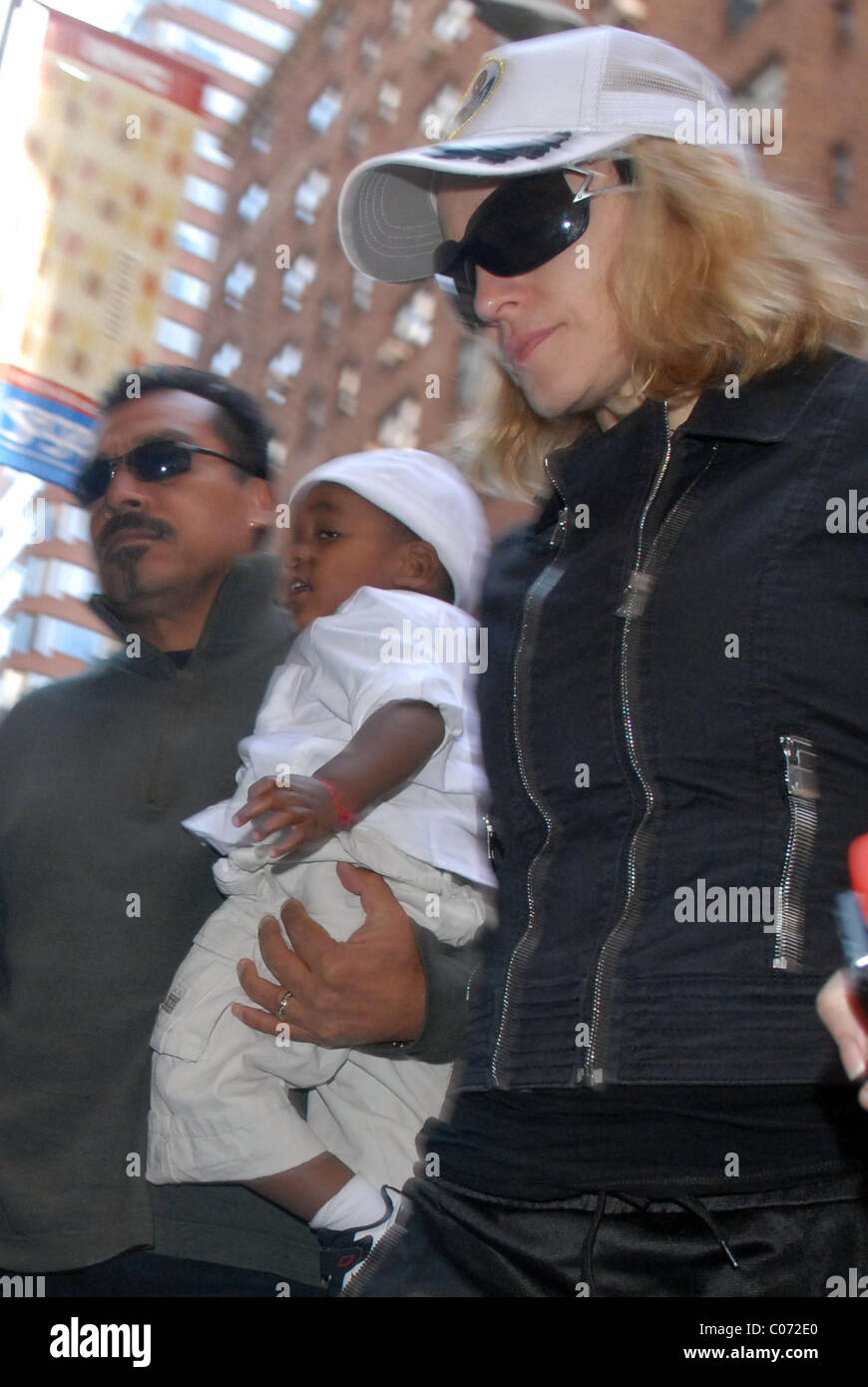 Madonna and her adopted son David Banda attending a Kabbalah meeting ...