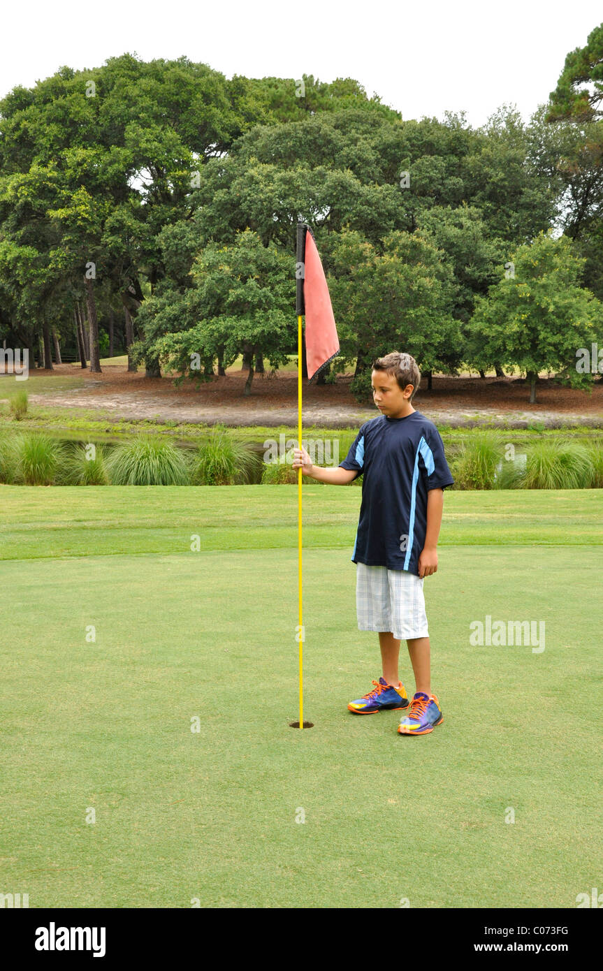 Boy on golf course hi-res stock photography and images - Alamy
