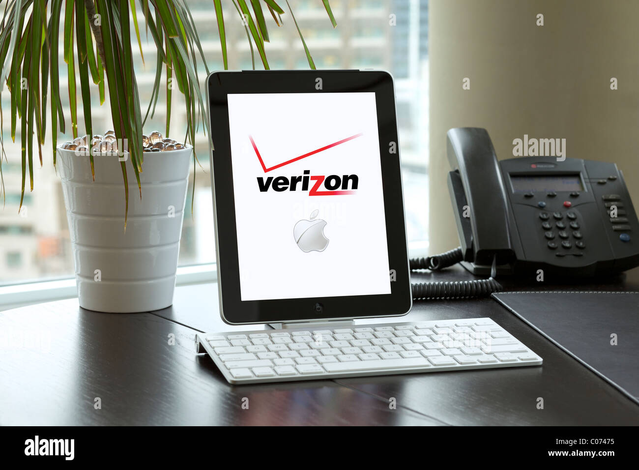 iPad being used in an office with wireless bluetooth keyboard showing ...