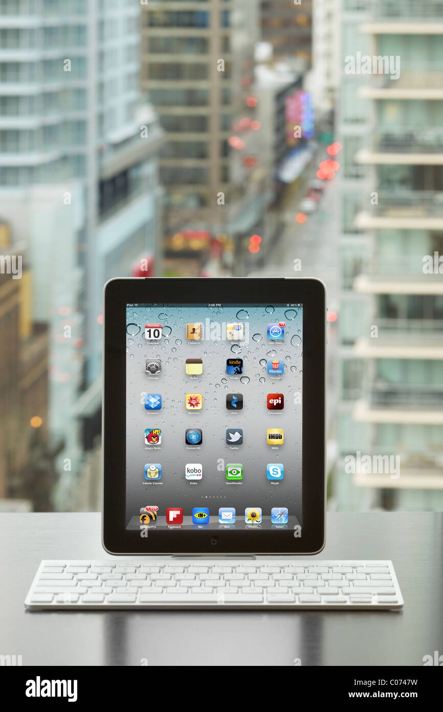 iPad being used in an office with wireless bluetooth keyboard showing ...