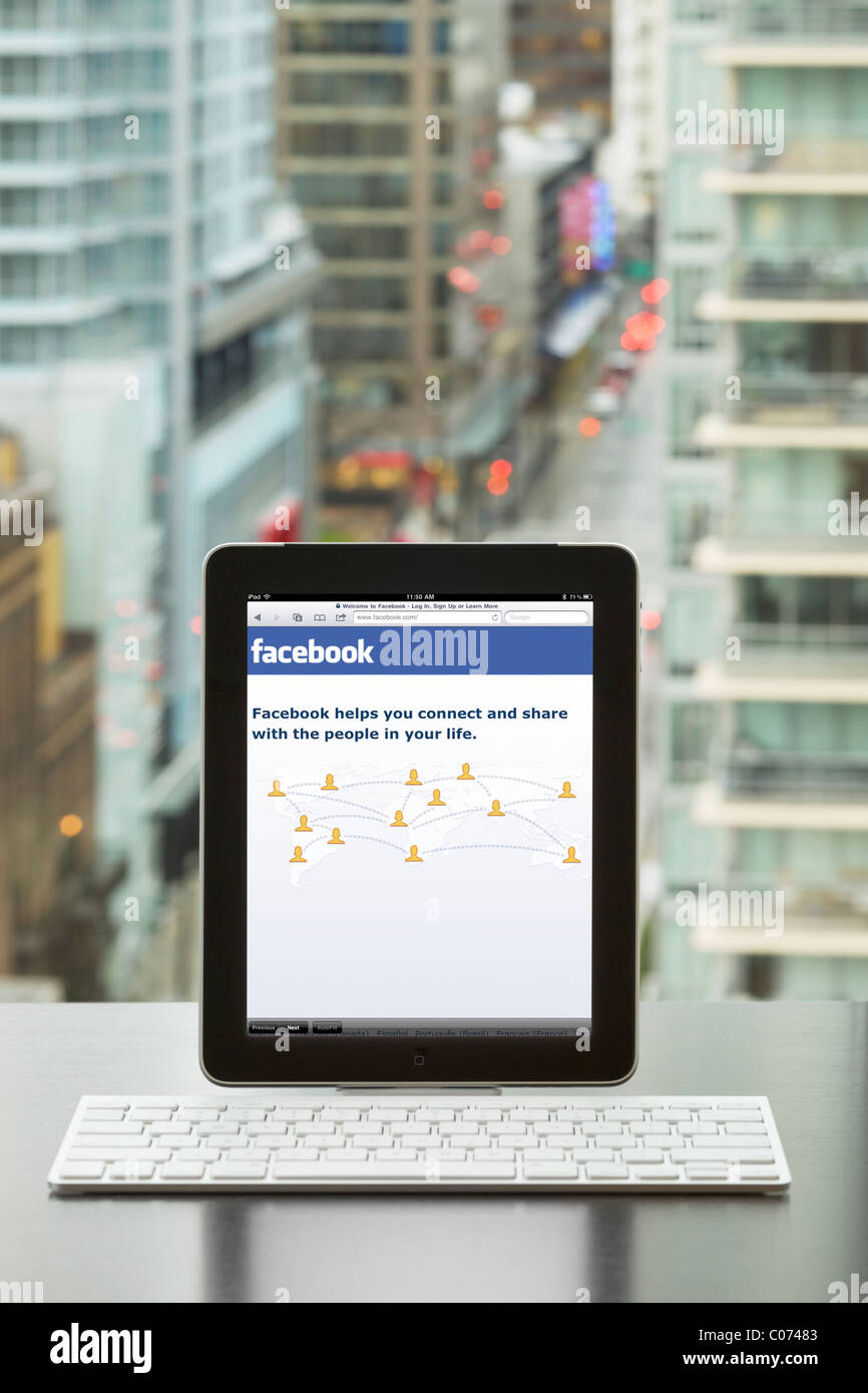 iPad being used in an office with wireless bluetooth keyboard showing ...