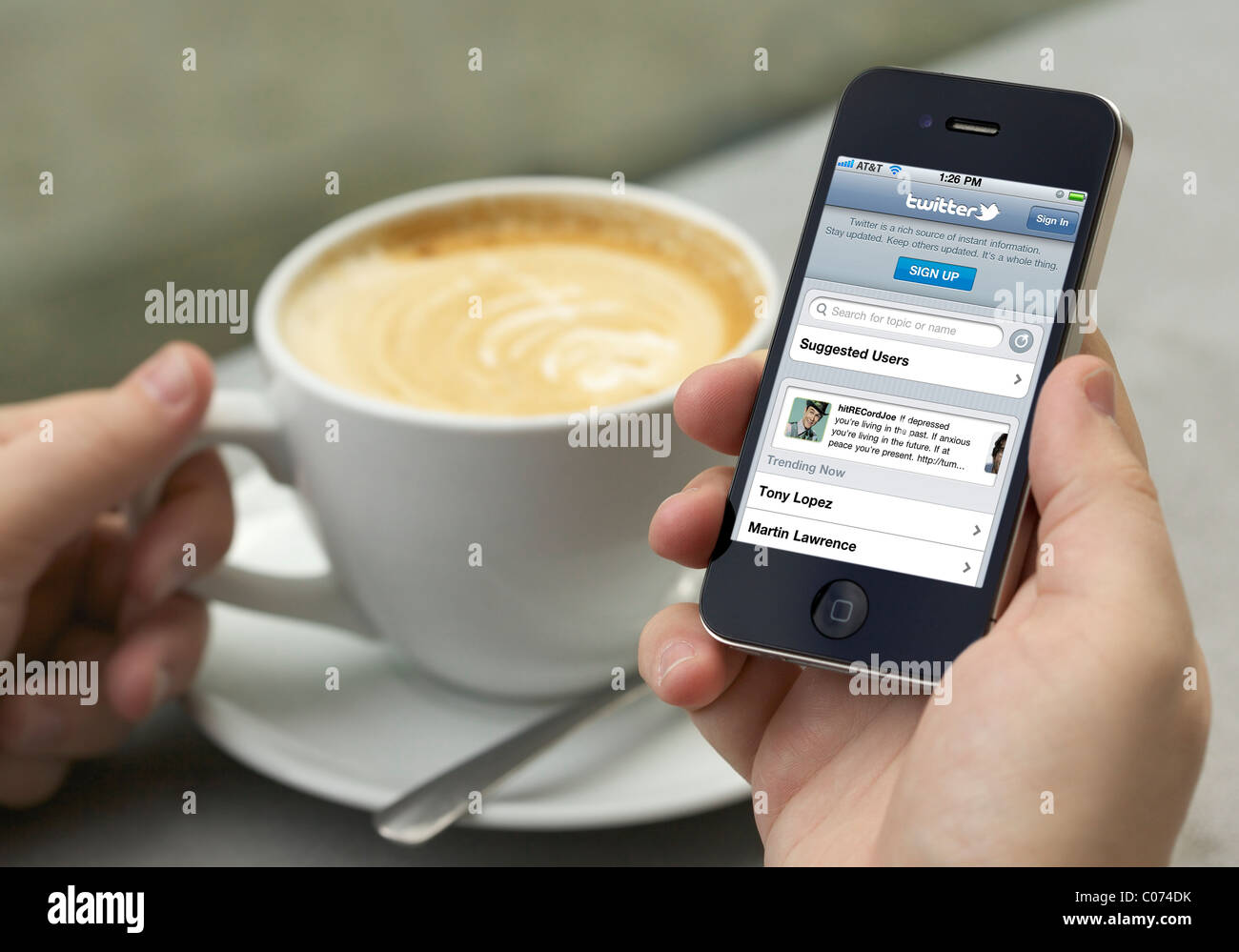 Man holding iphone 4 hi-res stock photography and images - Alamy