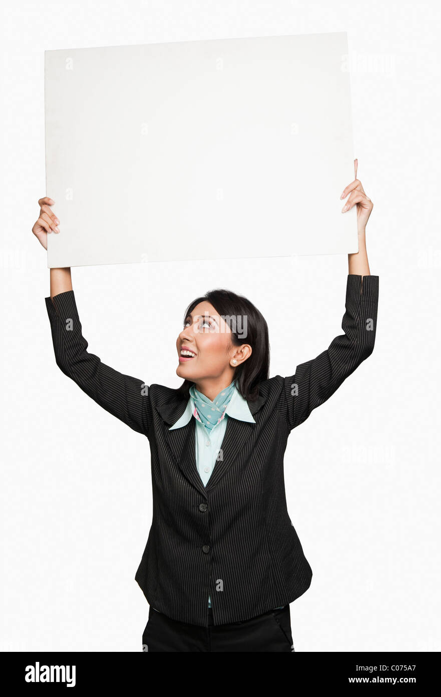 Person holding blank sign over head hi-res stock photography and images ...