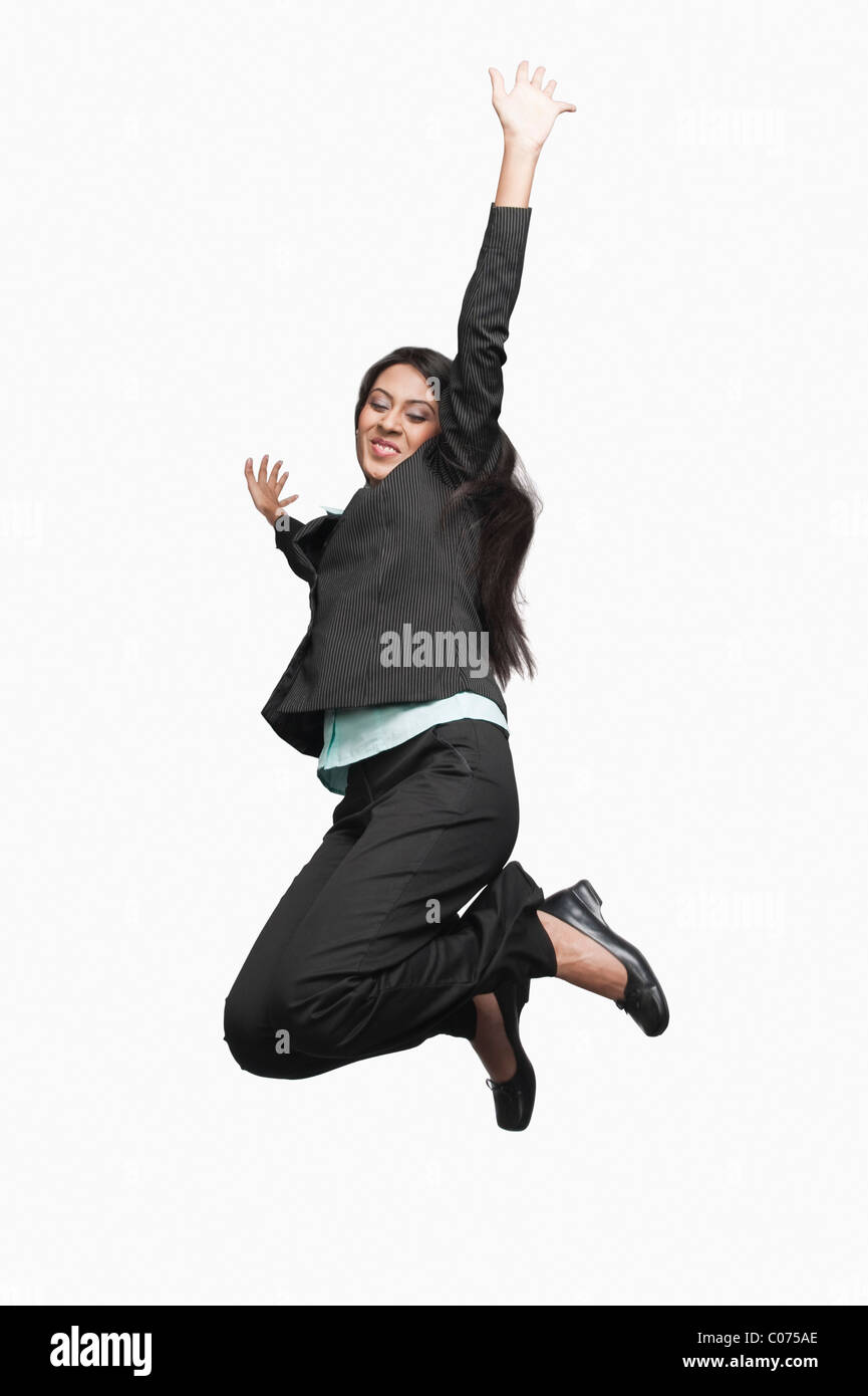Woman jumping for joy office Cut Out Stock Images & Pictures - Alamy
