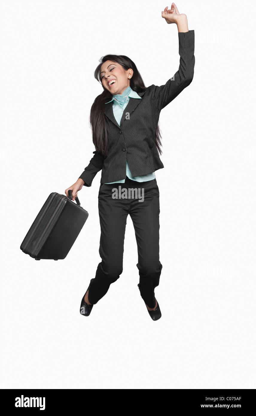 Woman jumping for joy office Cut Out Stock Images & Pictures - Alamy