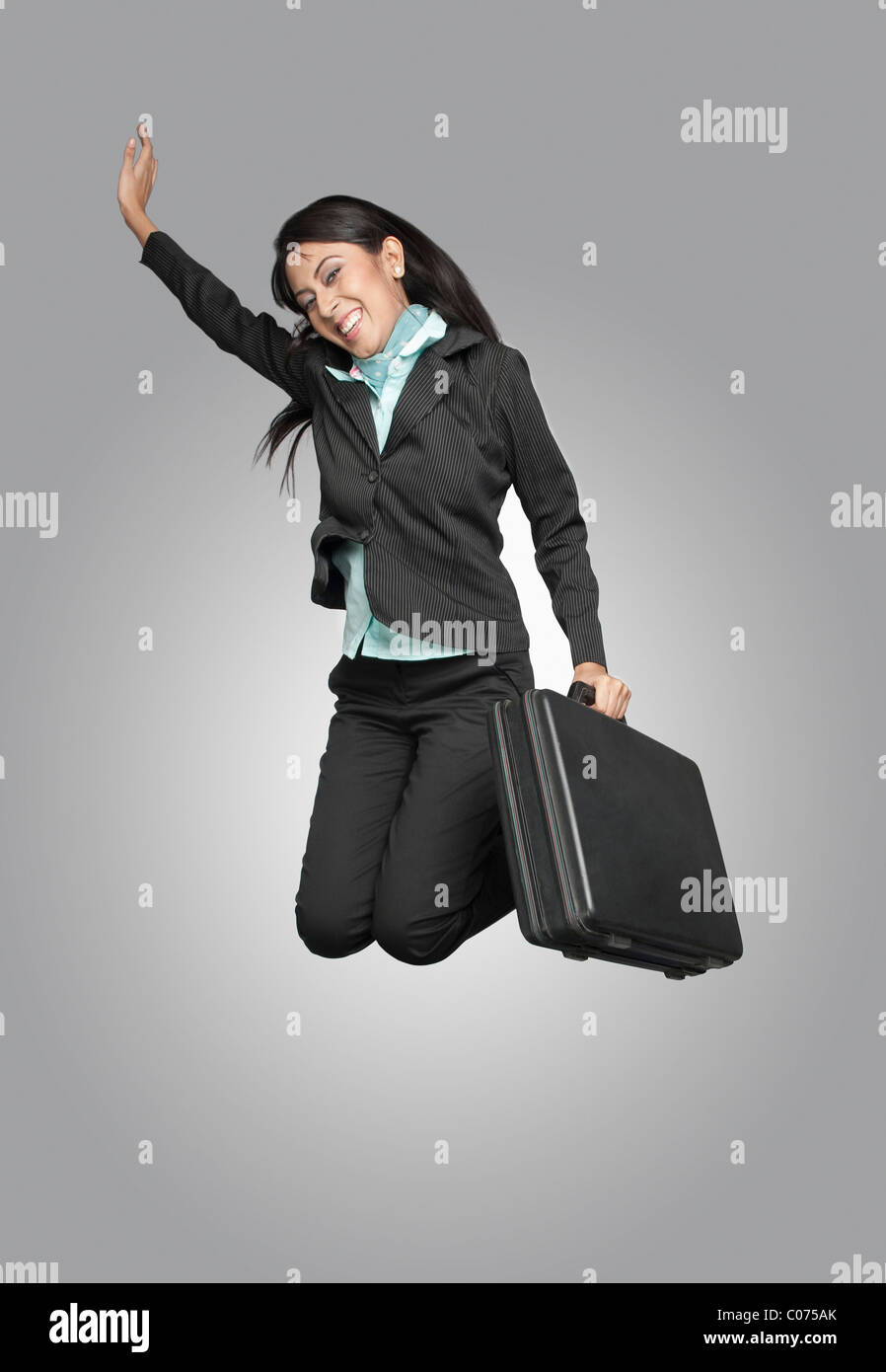 Woman jumping for joy office hi-res stock photography and images - Alamy