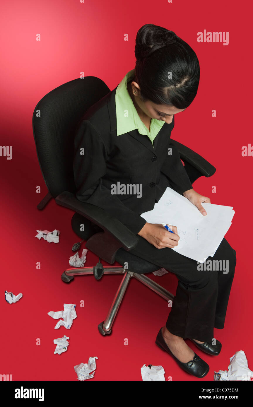 Woman surrounded by paperwork hi-res stock photography and images - Alamy