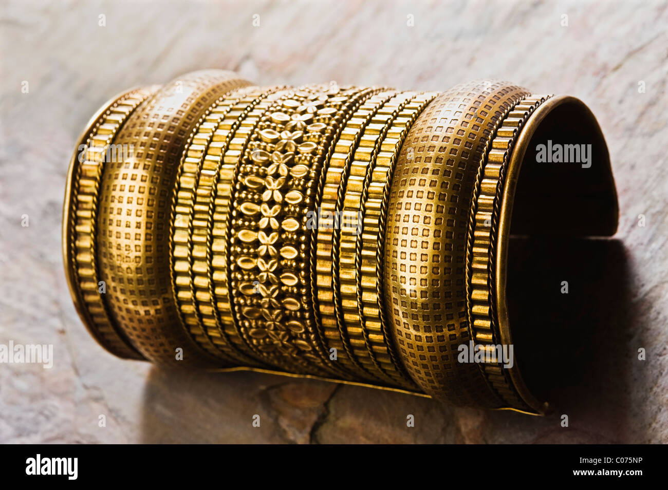 Close-up of a traditional golden armlet Stock Photo - Alamy
