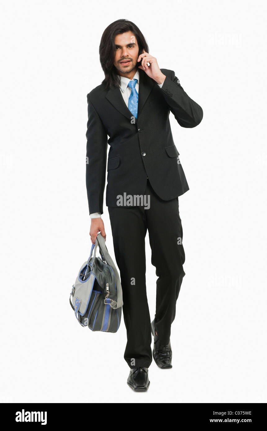 Business man walking and talking Cut Out Stock Images & Pictures - Alamy