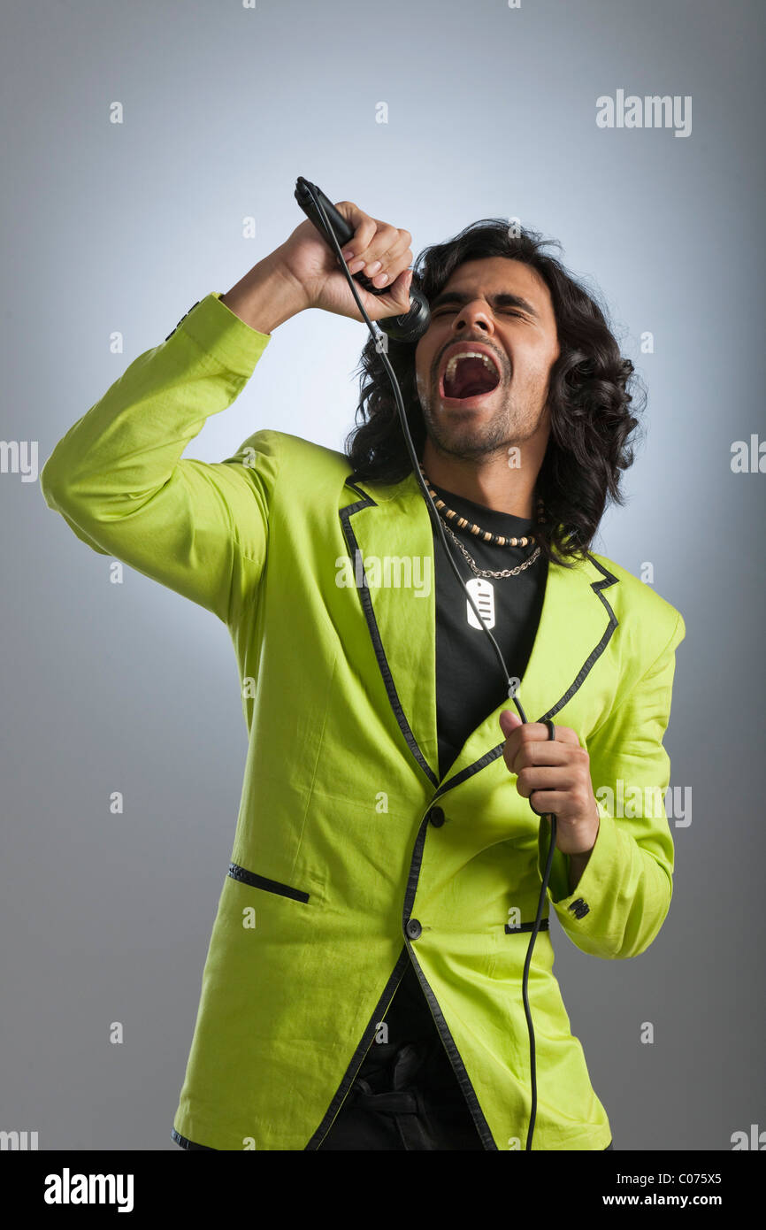 Skill holding microphone eyes closed performance singing standing hi ...