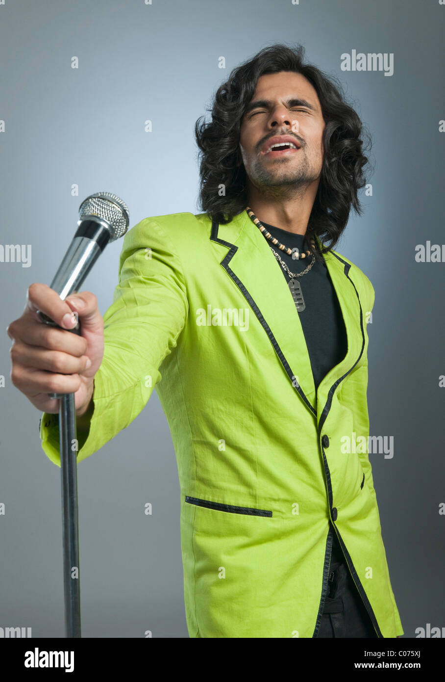 Skill holding microphone eyes closed performance singing standing hi ...