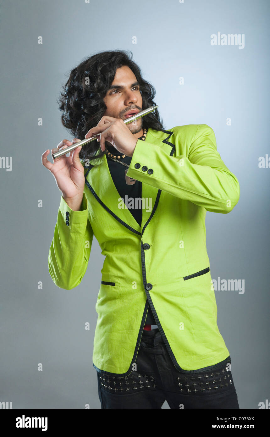 Man playing a flute Stock Photo - Alamy