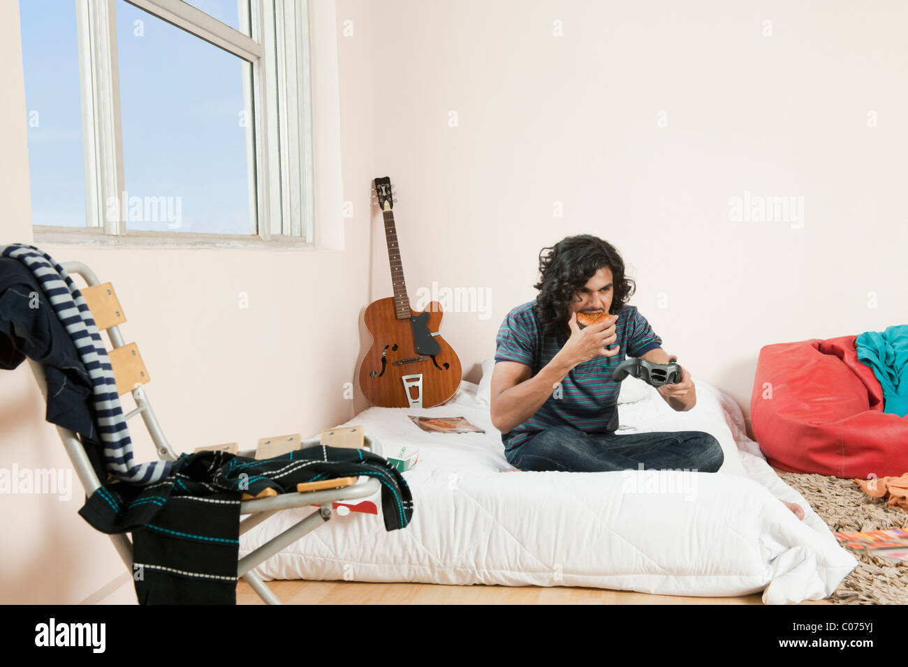 Man playing a video game Stock Photo - Alamy