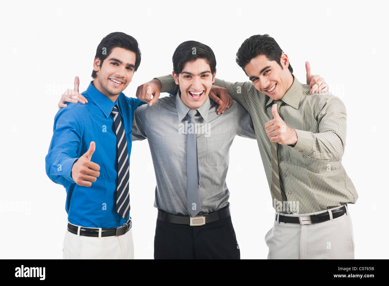 Portrait of three businessmen cheering Stock Photo - Alamy