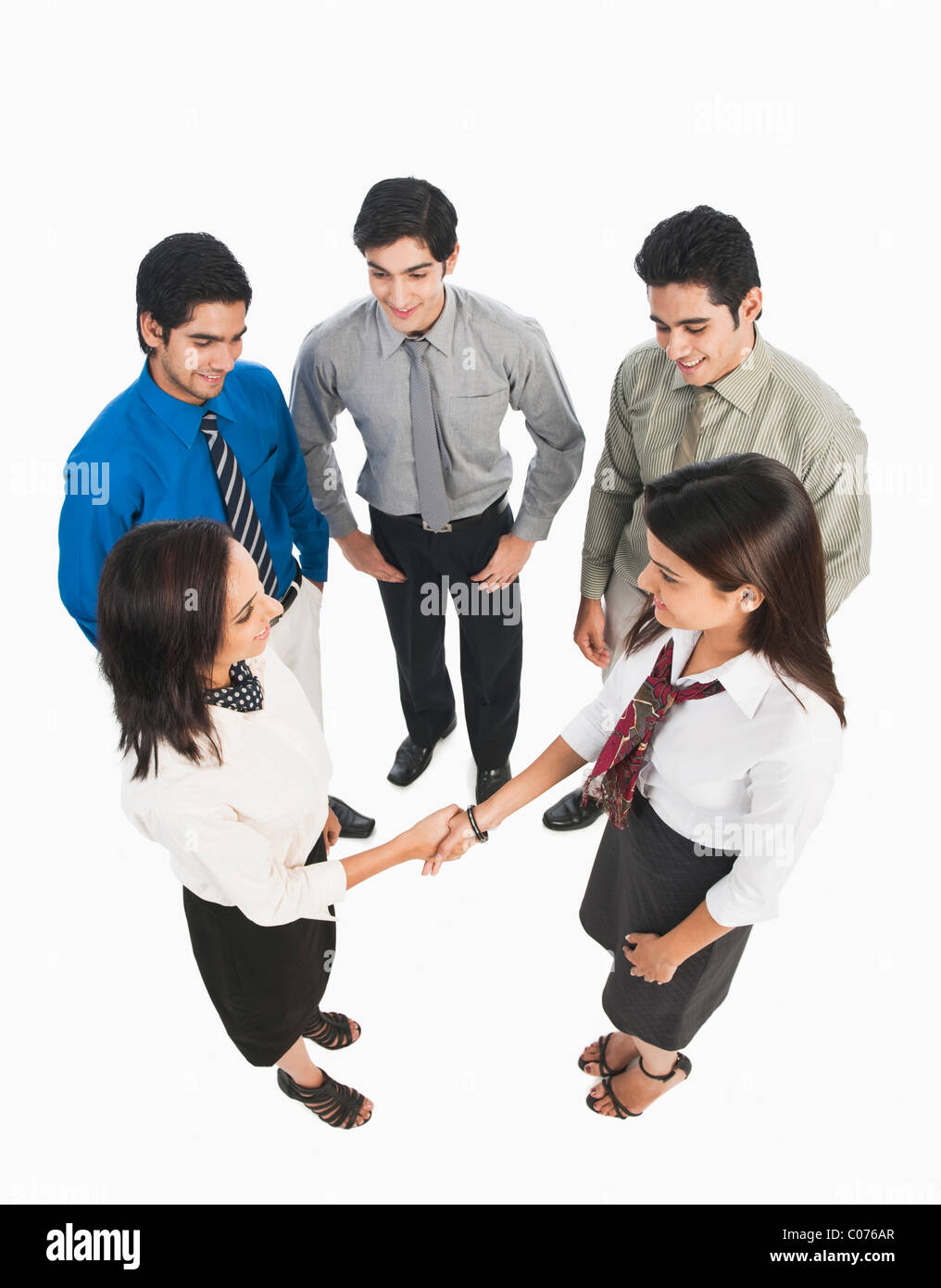 Standing shaking hands arms crossed greeting hi-res stock photography ...