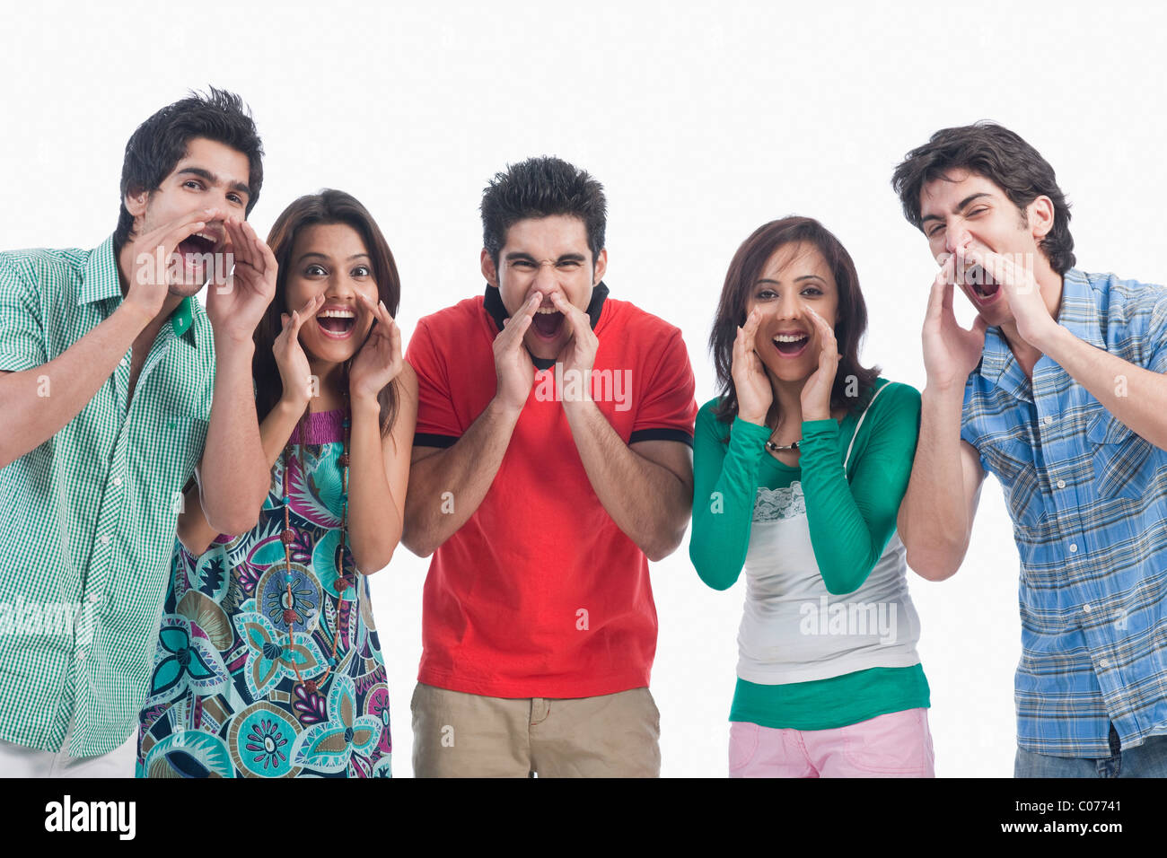 Group of friends shouting Stock Photo - Alamy