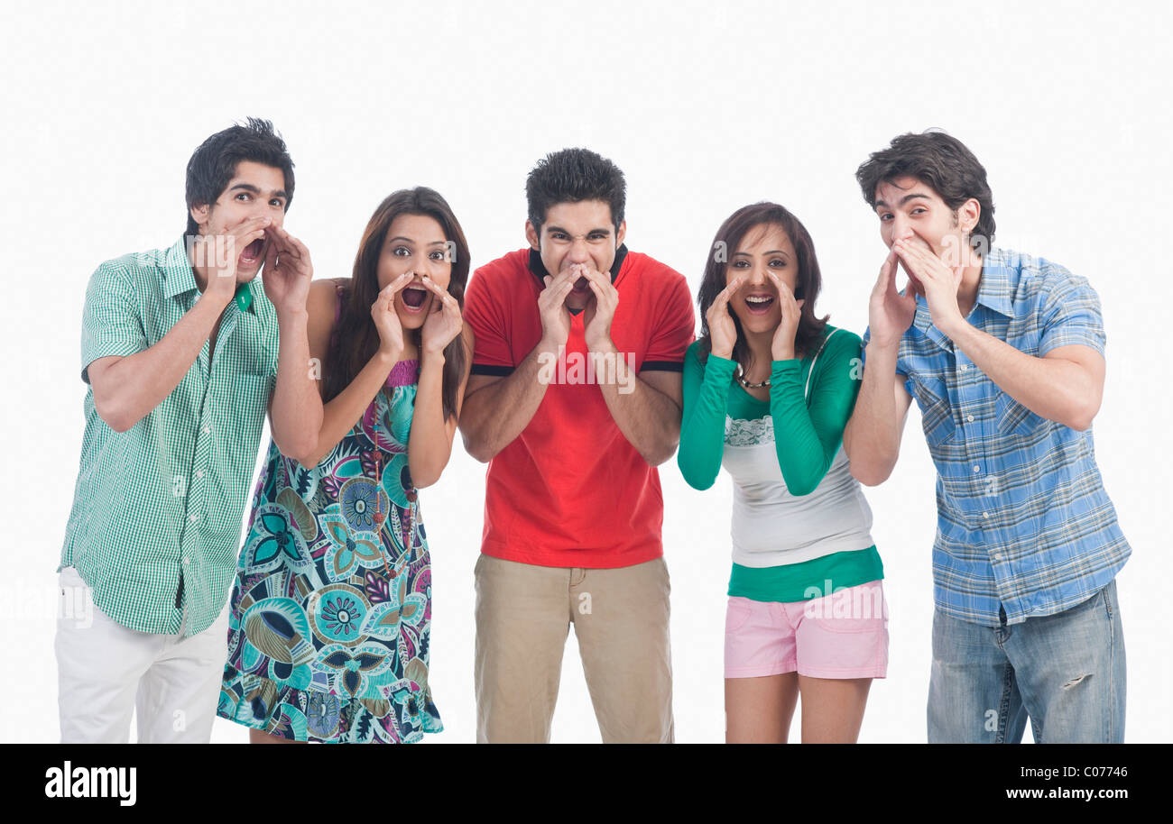 Group of friends shouting Stock Photo - Alamy