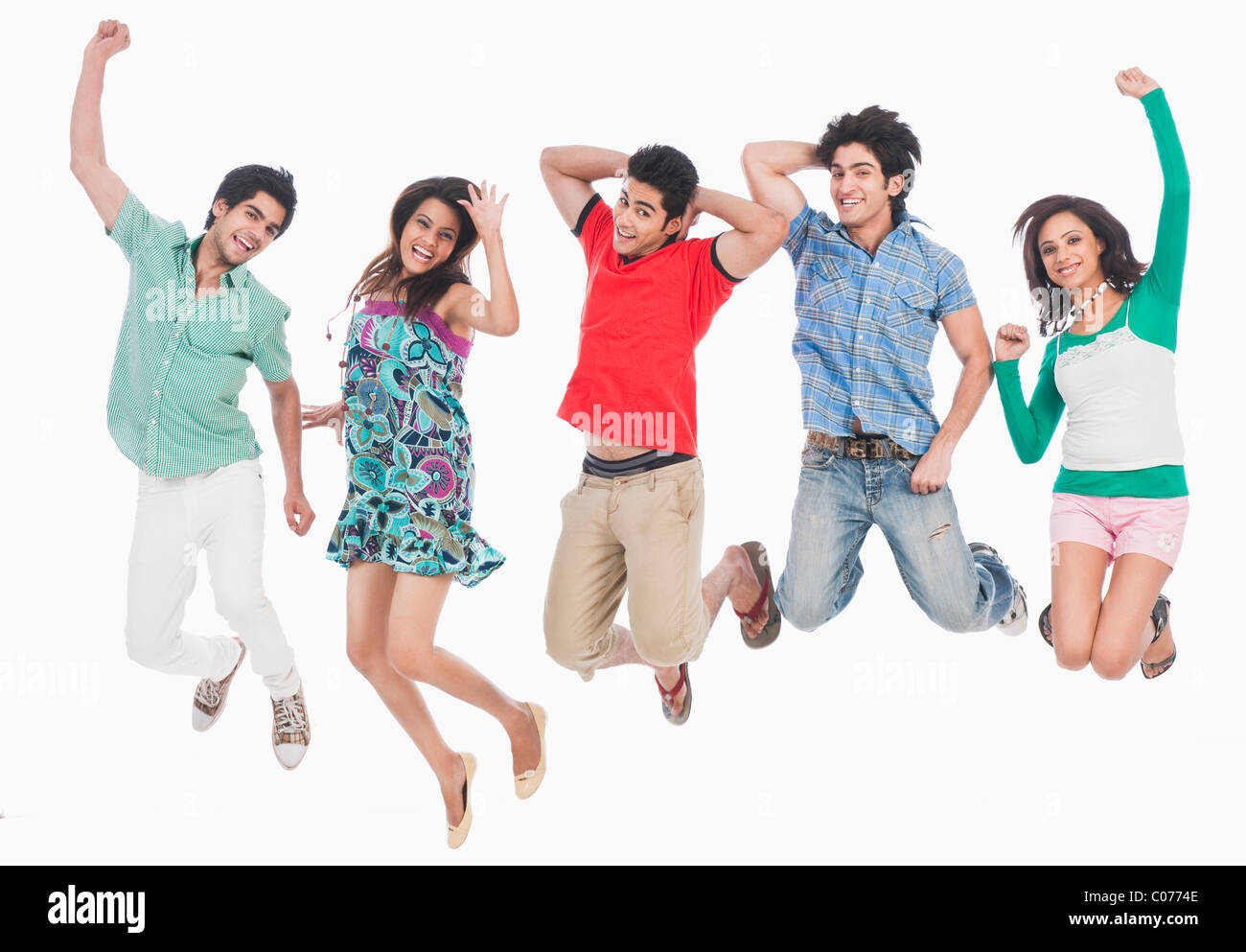 Group of friends jumping Stock Photo - Alamy