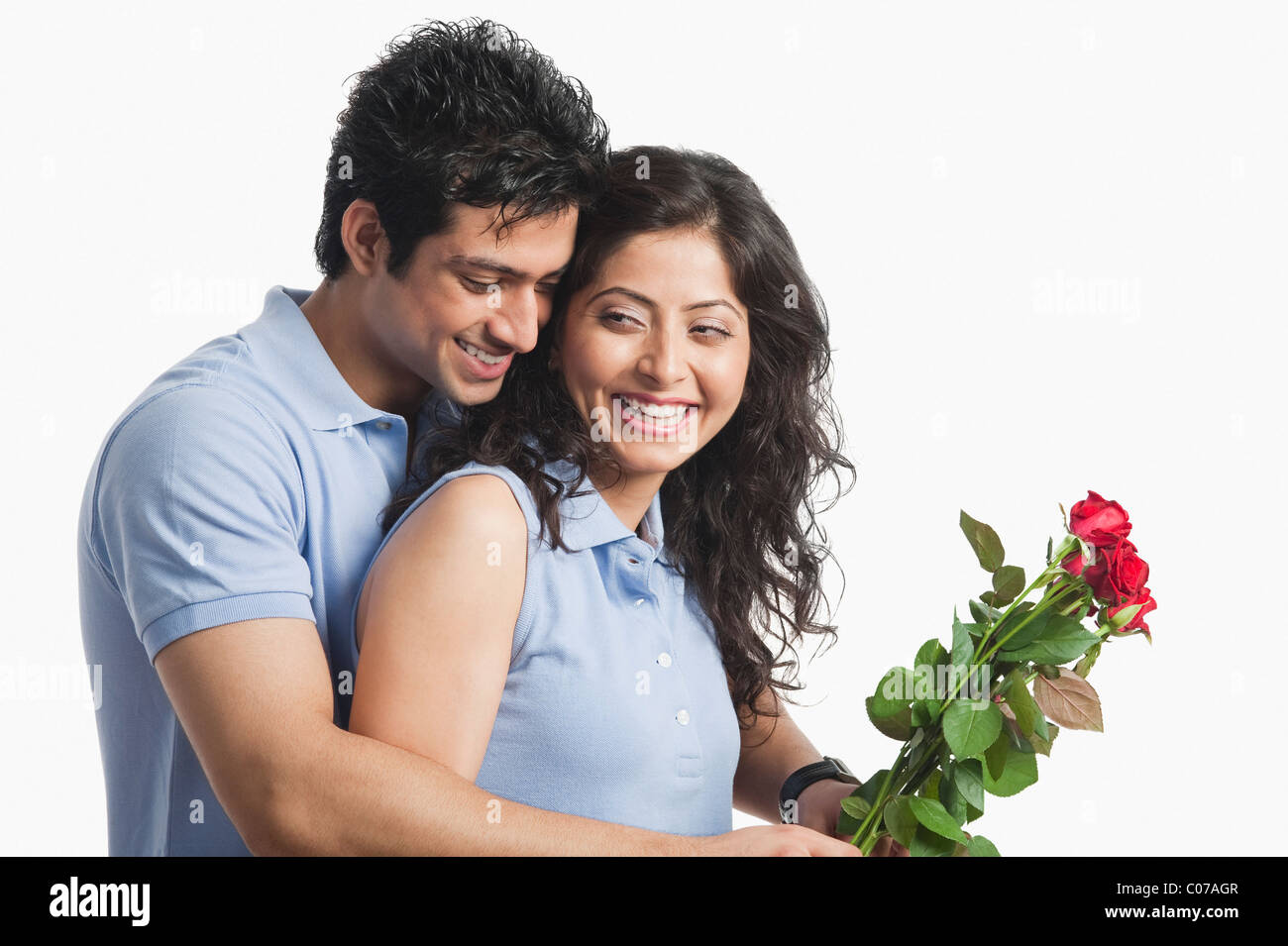 Romantic couple with red roses Stock Photo - Alamy