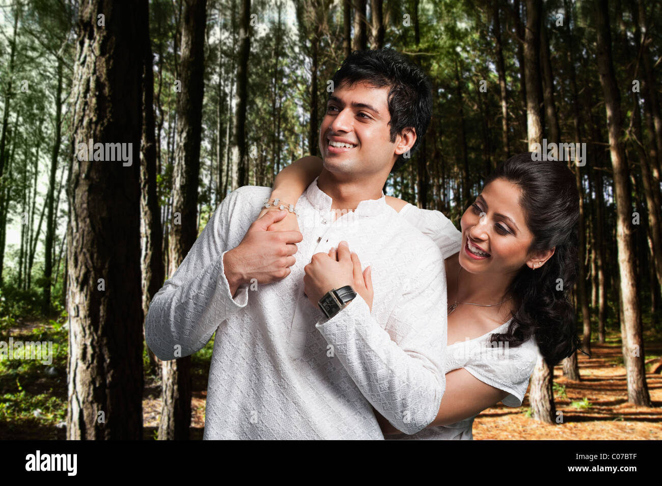 Romantic couple in a forest Stock Photo - Alamy