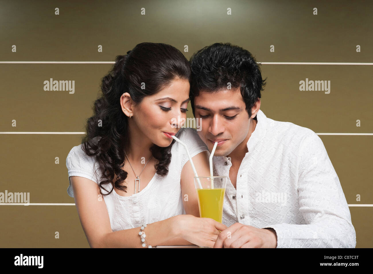 Couple drinking juice together Stock Photo - Alamy Couple drinking juice together Stock Photo - Alamy