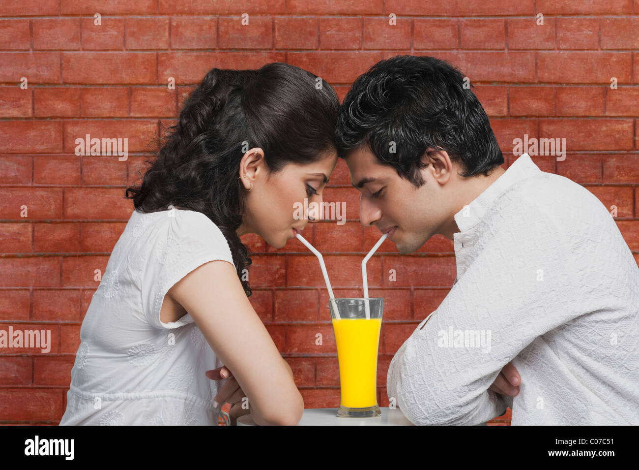 Couple drinking juice together Stock Photo - Alamy Couple drinking juice together Stock Photo - Alamy