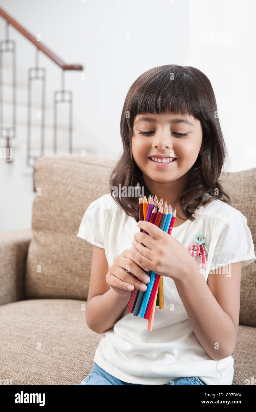 Girl holding colored pencils Stock Photo - Alamy Girl holding colored pencils Stock Photo - Alamy