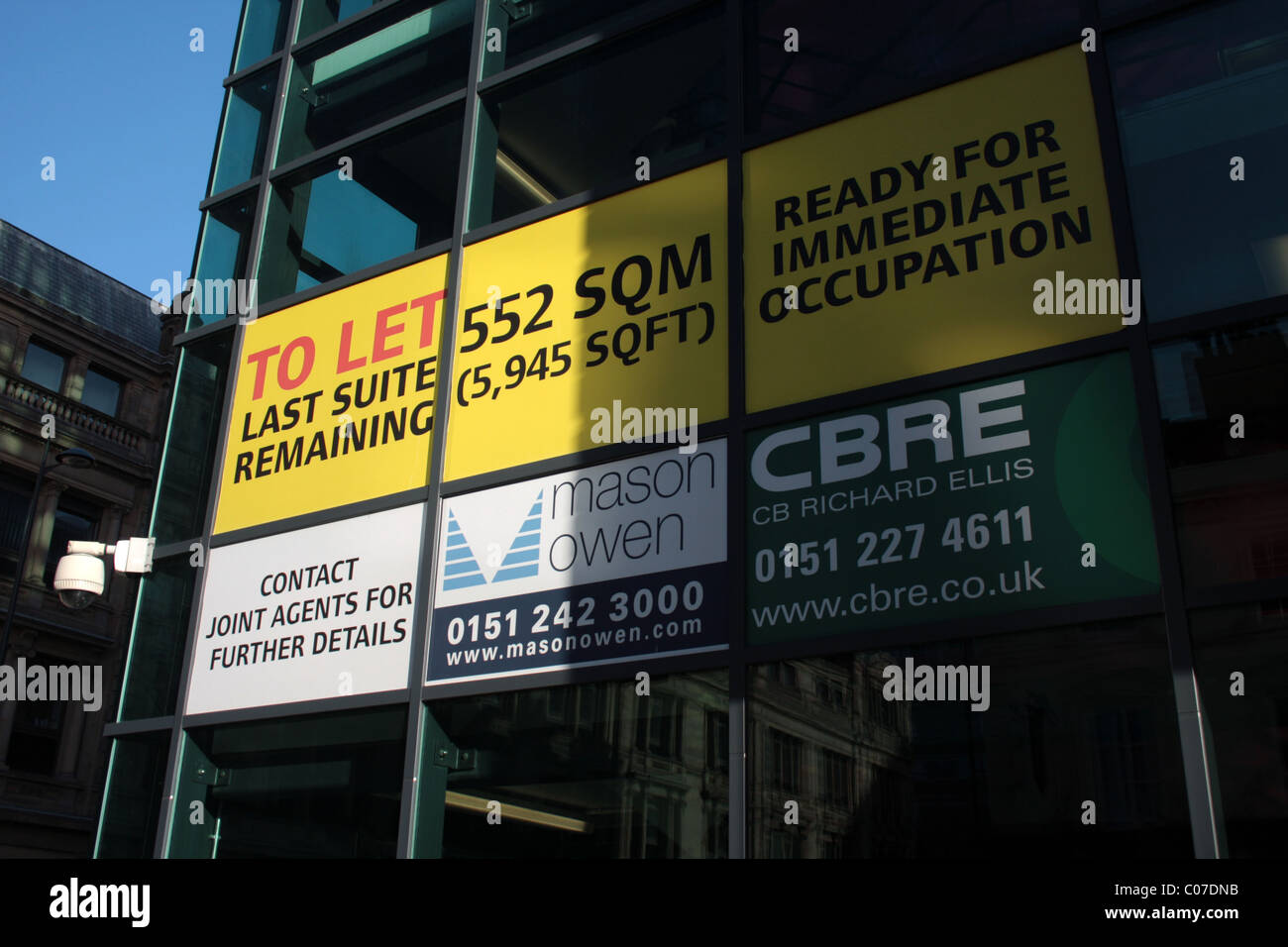 large yellow To Let signs in LIverpool office buildings Stock Photo - Alamy