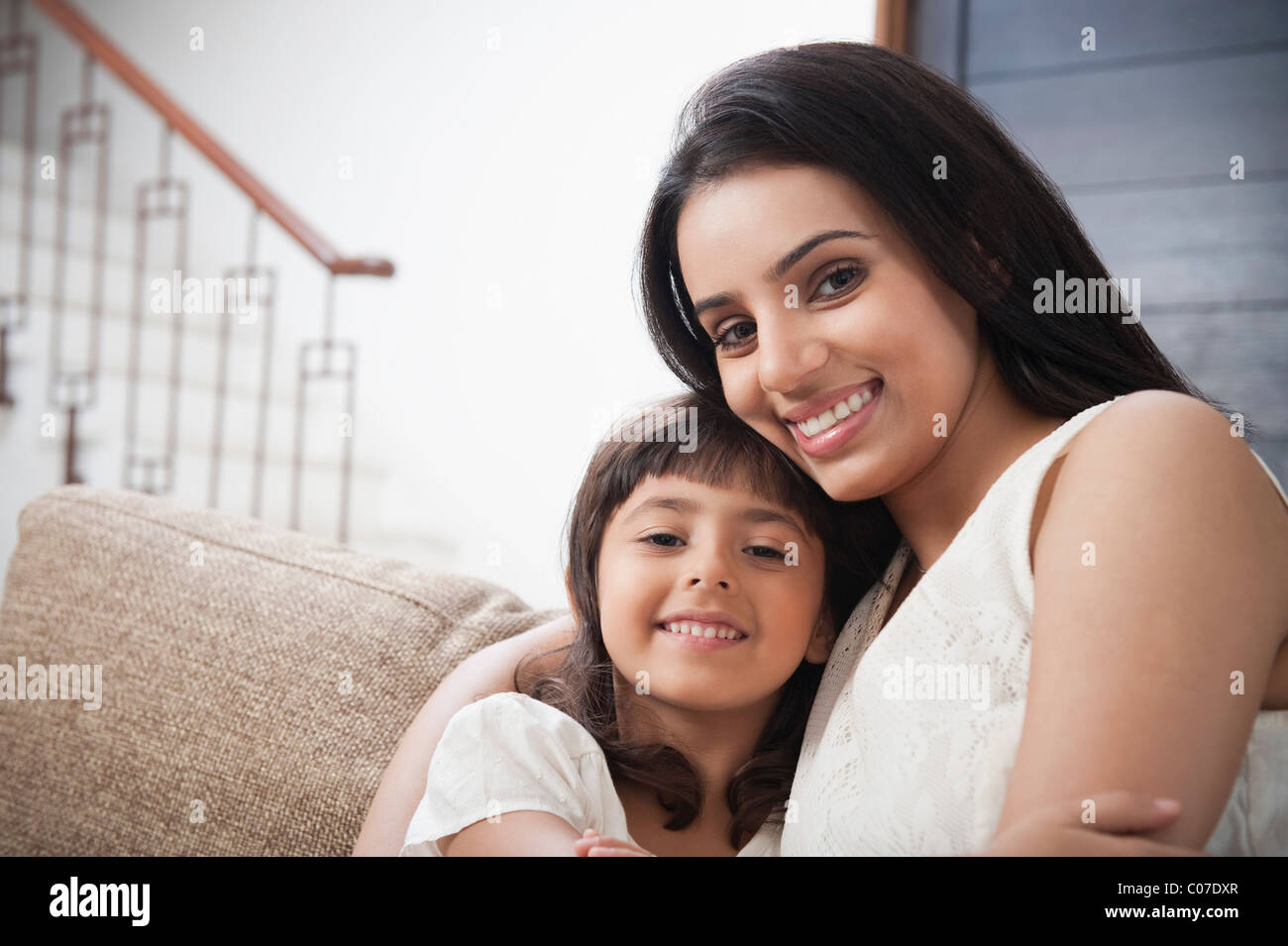 Portrait of a woman smiling with her daughter Stock Photo - Alamy