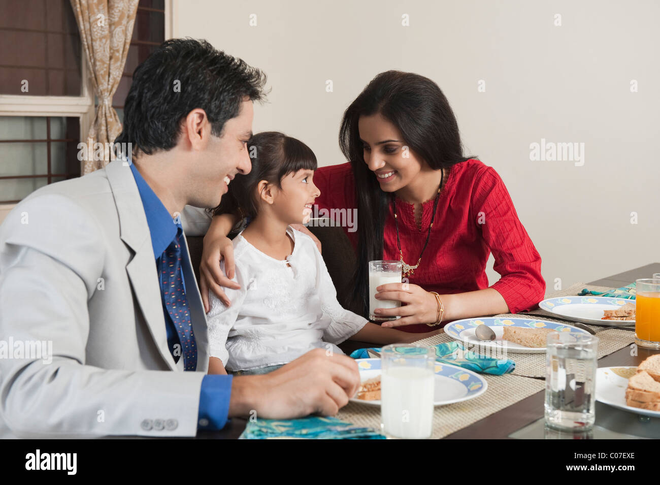Family at a breakfast table Stock Photo - Alamy
