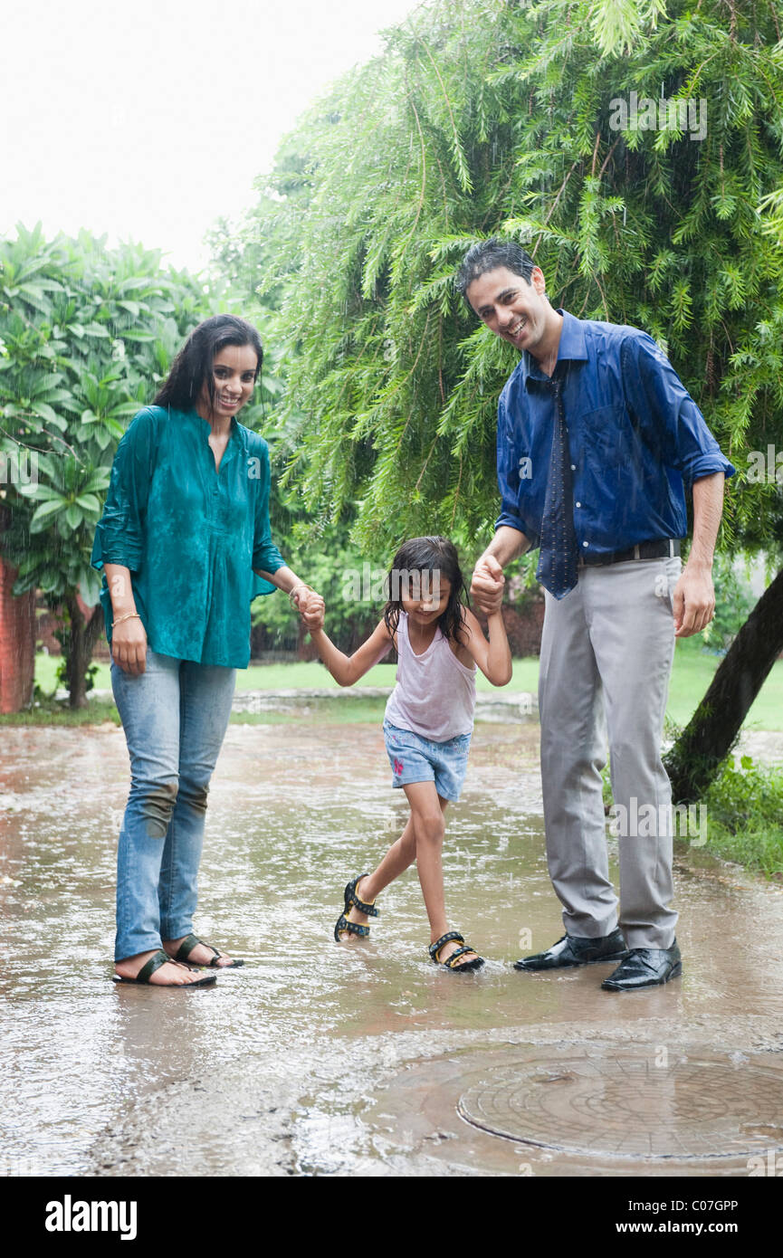 Indian family enjoying rain hi-res stock photography and images - Alamy