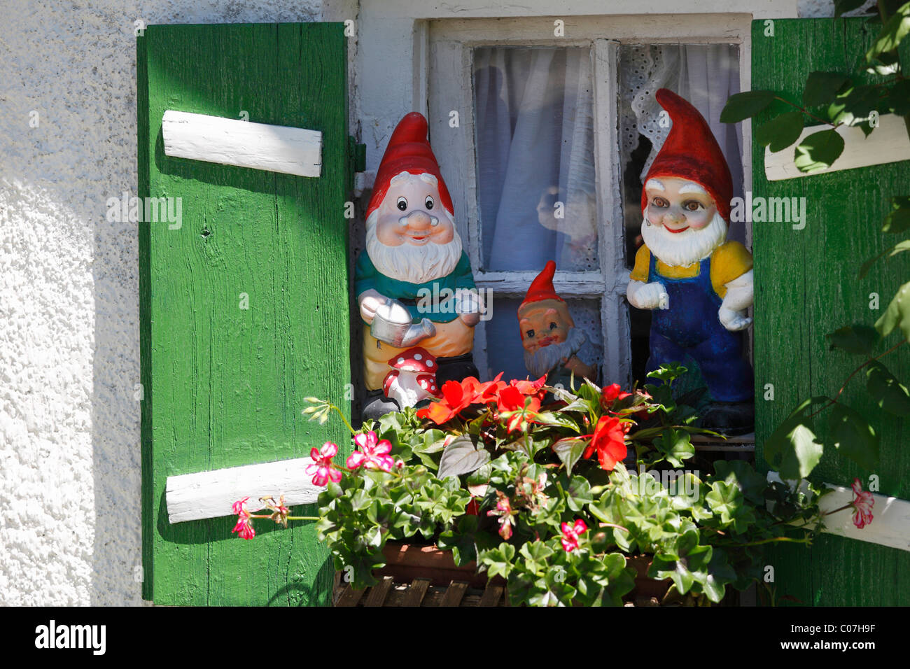 Garden gnomes in a window, Wessling, Fuenfseenland or Five Lakes region ...