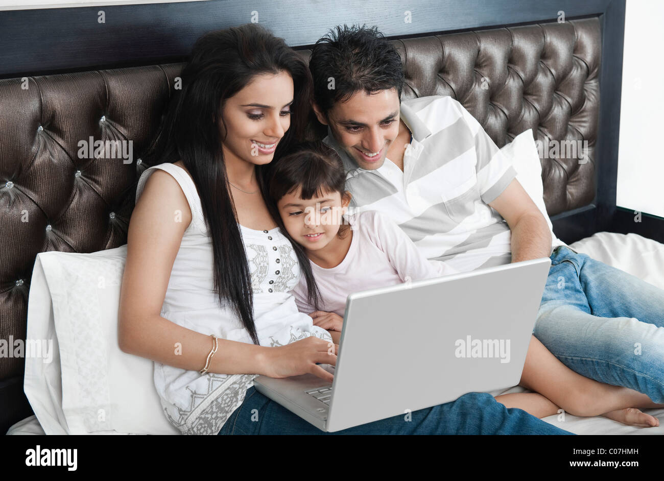 Family using a laptop Stock Photo - Alamy