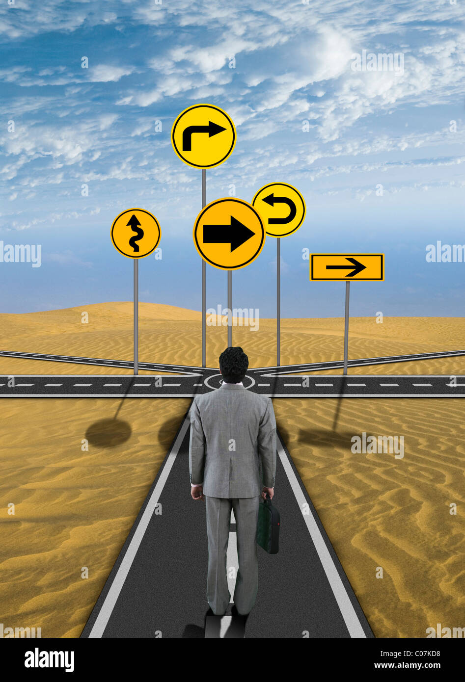 Businessman standing in front of road signs Stock Photo - Alamy Businessman standing in front of road signs Stock Photo - Alamy
