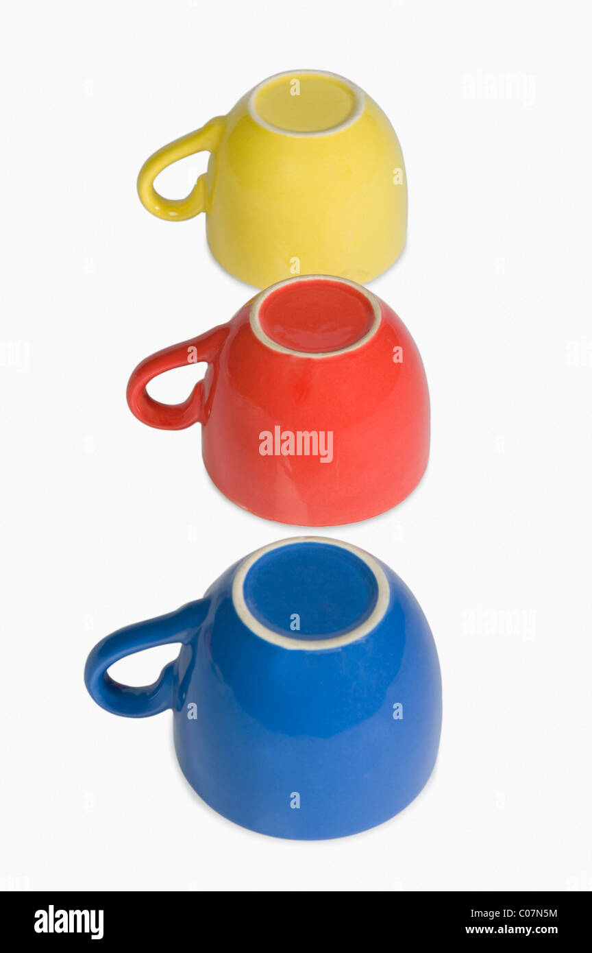 Close-up of colorful tea cups in a row Stock Photo - Alamy