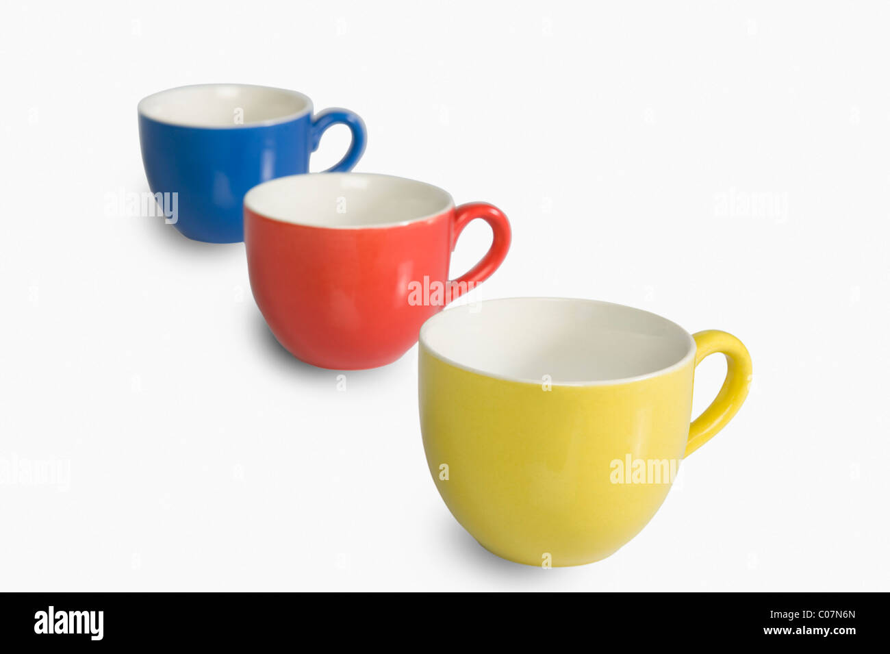 Close-up of colorful tea cups in a row Stock Photo - Alamy