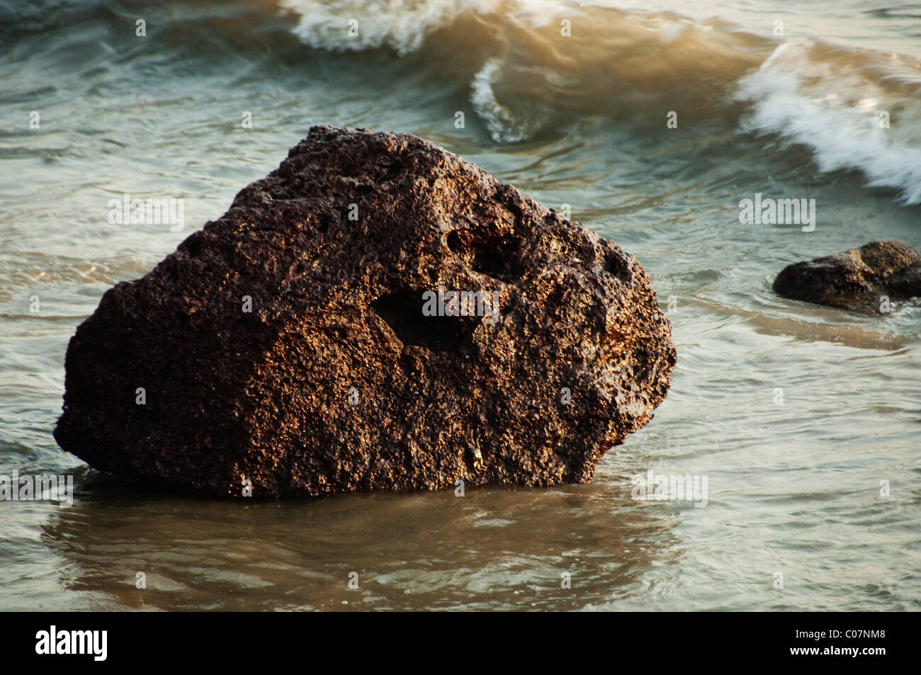 Rock on the beach, Goa, India Stock Photo - Alamy