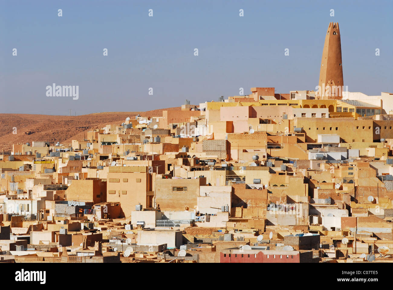 Algeria, Ghardaia, view of city with mud-brick dwelling and tall ...