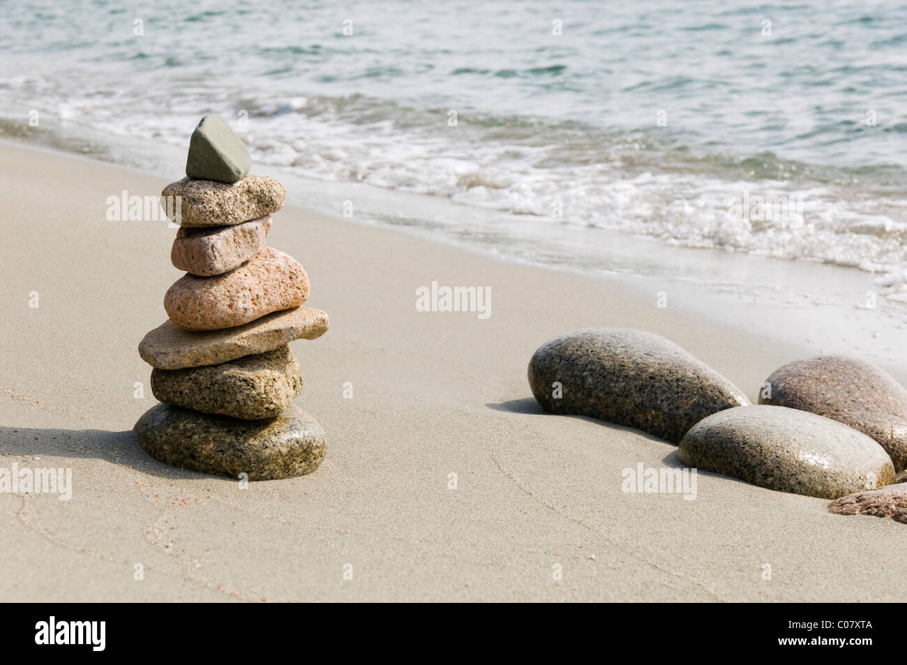 Stone pyramid on the beach, Gulf of Pinarellu, East Coast, Corsica ...