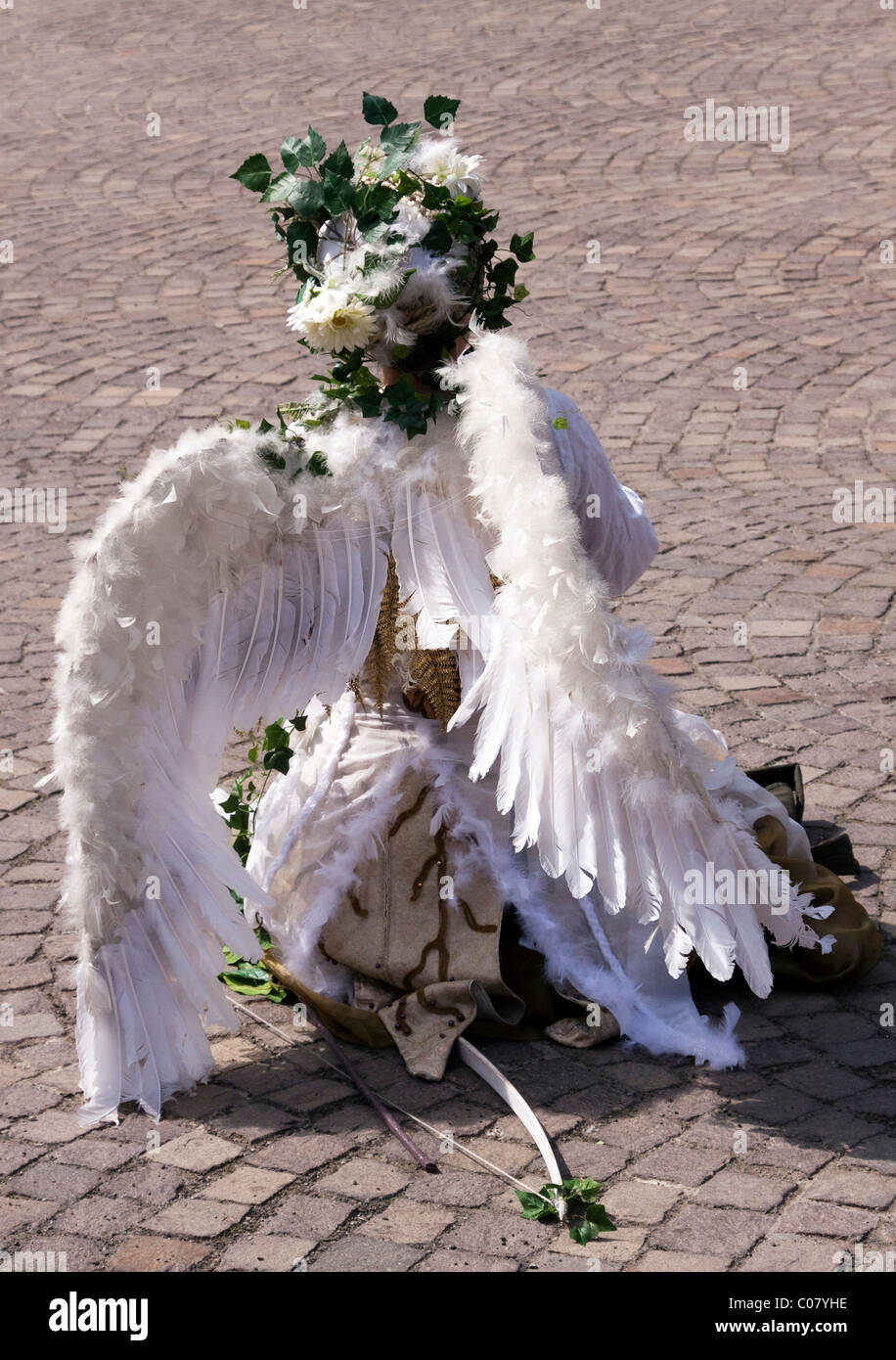 Street performer wearing an angel costume Stock Photo - Alamy