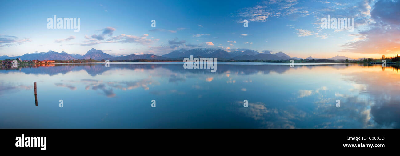 Panoramic view of a sunset at Lake Hopfensee and the Alps, Fuessen ...