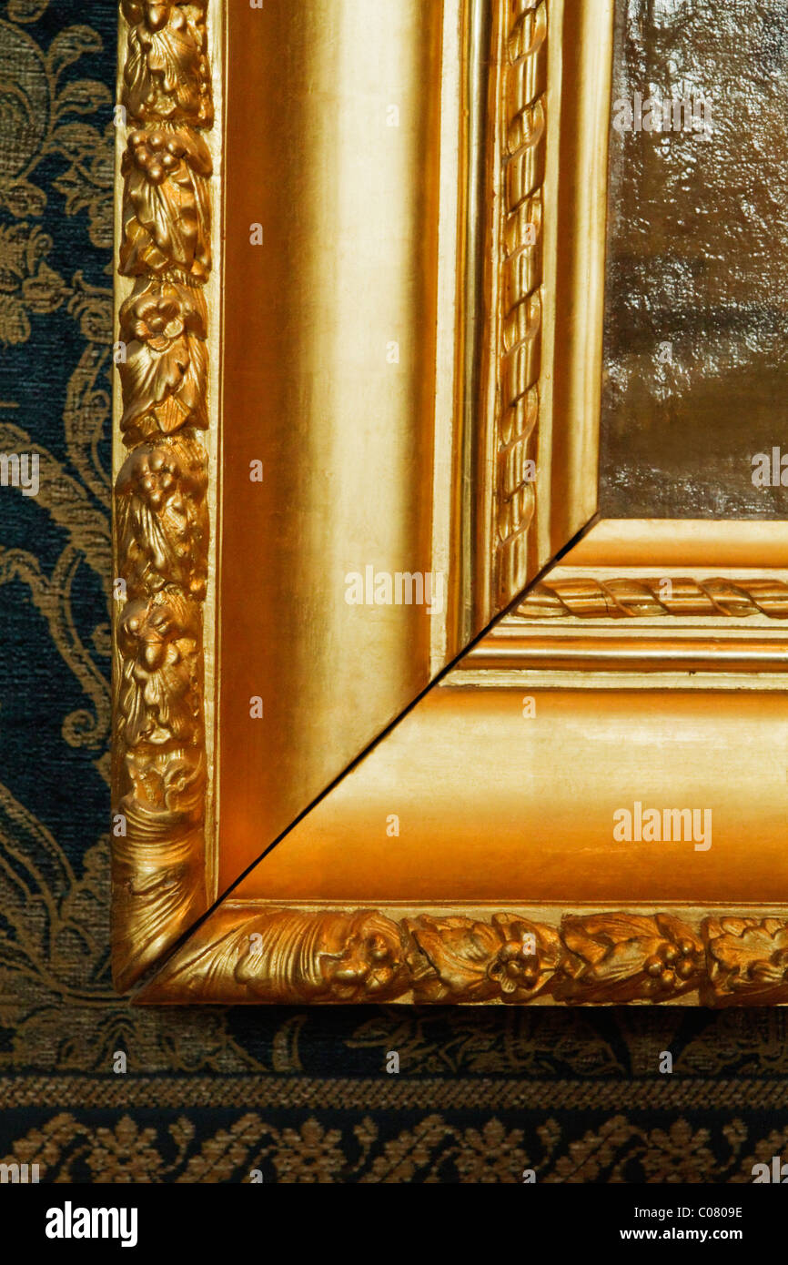 Details of the golden frame of a painting in a museum, Musee du Louvre ...