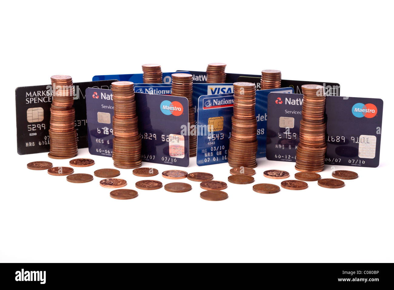 Piles of centimo coins with credit and debit cards Stock Photo - Alamy